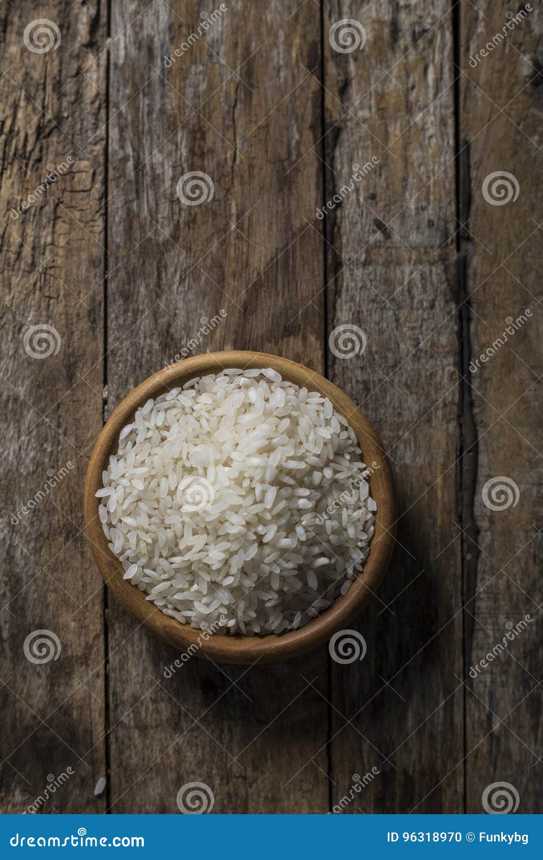 Raw white rice in a bowl stock photo. Image of brown - 96318970
