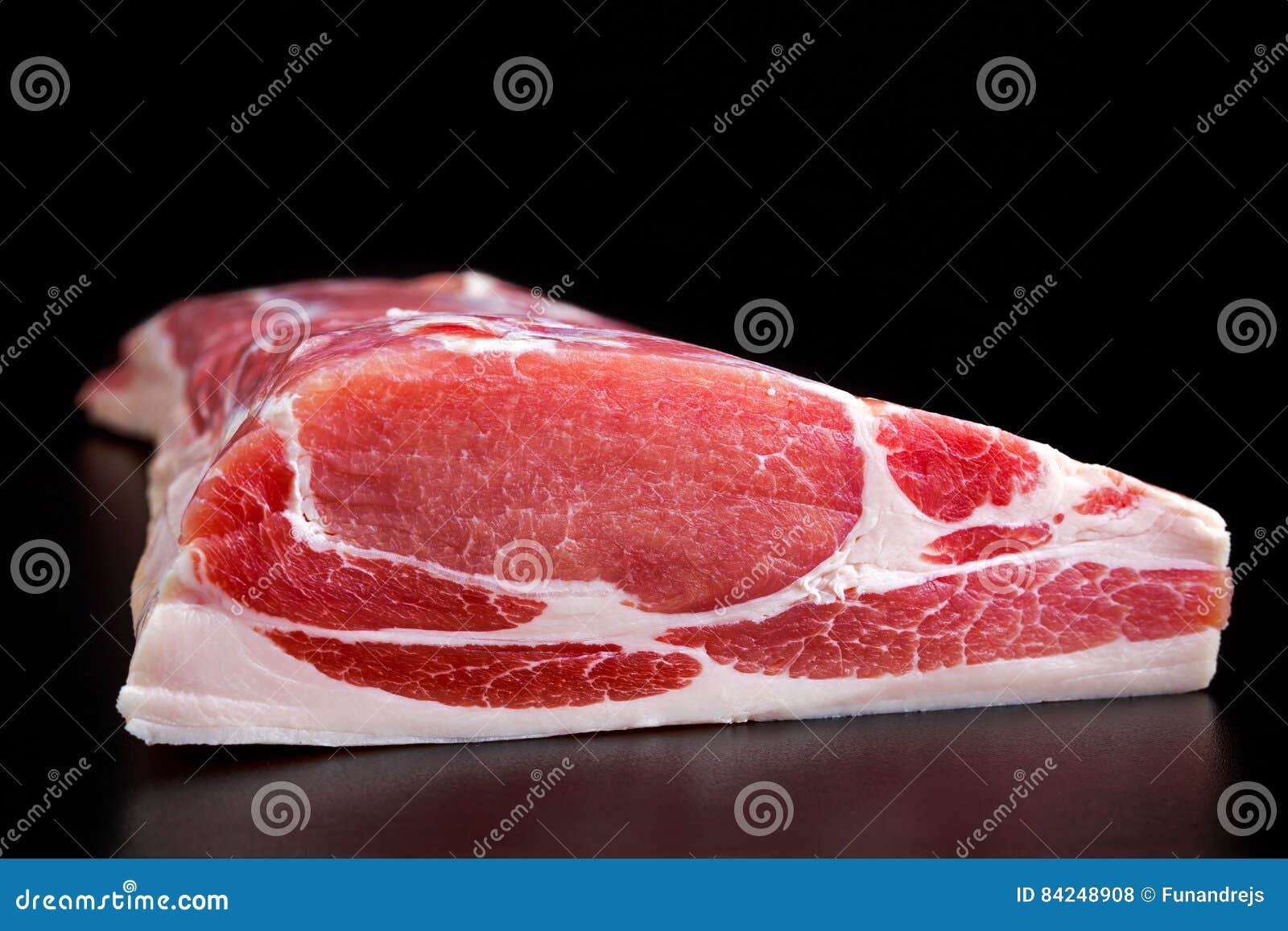 Raw Whole Back Bacon Loin on Black Board Background Stock Photo - Image ...