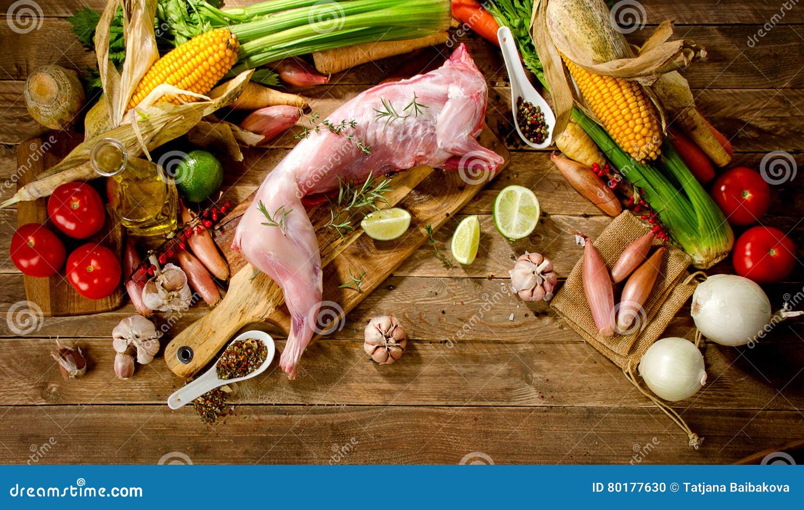 Raw Whole Rabbit with Vegetables and Spices on a Dark Rustic Ba Stock ...