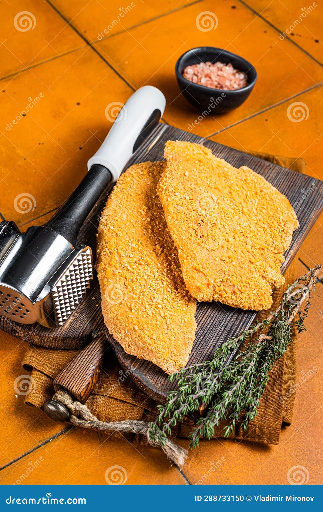 Raw Wiener Schnitzel Breaded Meat Steak. Orange Background Stock Photo ...