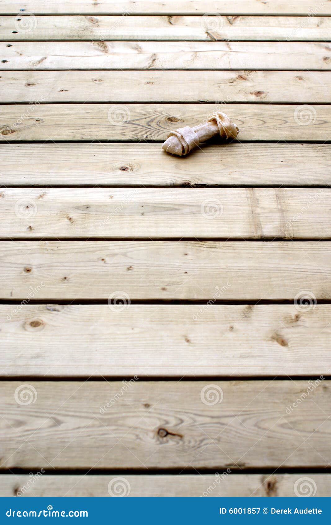 Rawhide Dog Bone on Wood Board Background Stock Image - Image of ...