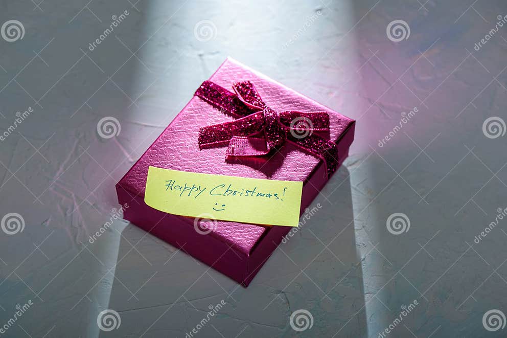A Ray of Light Illuminates the Happy Christmas Note on the Gift Box ...