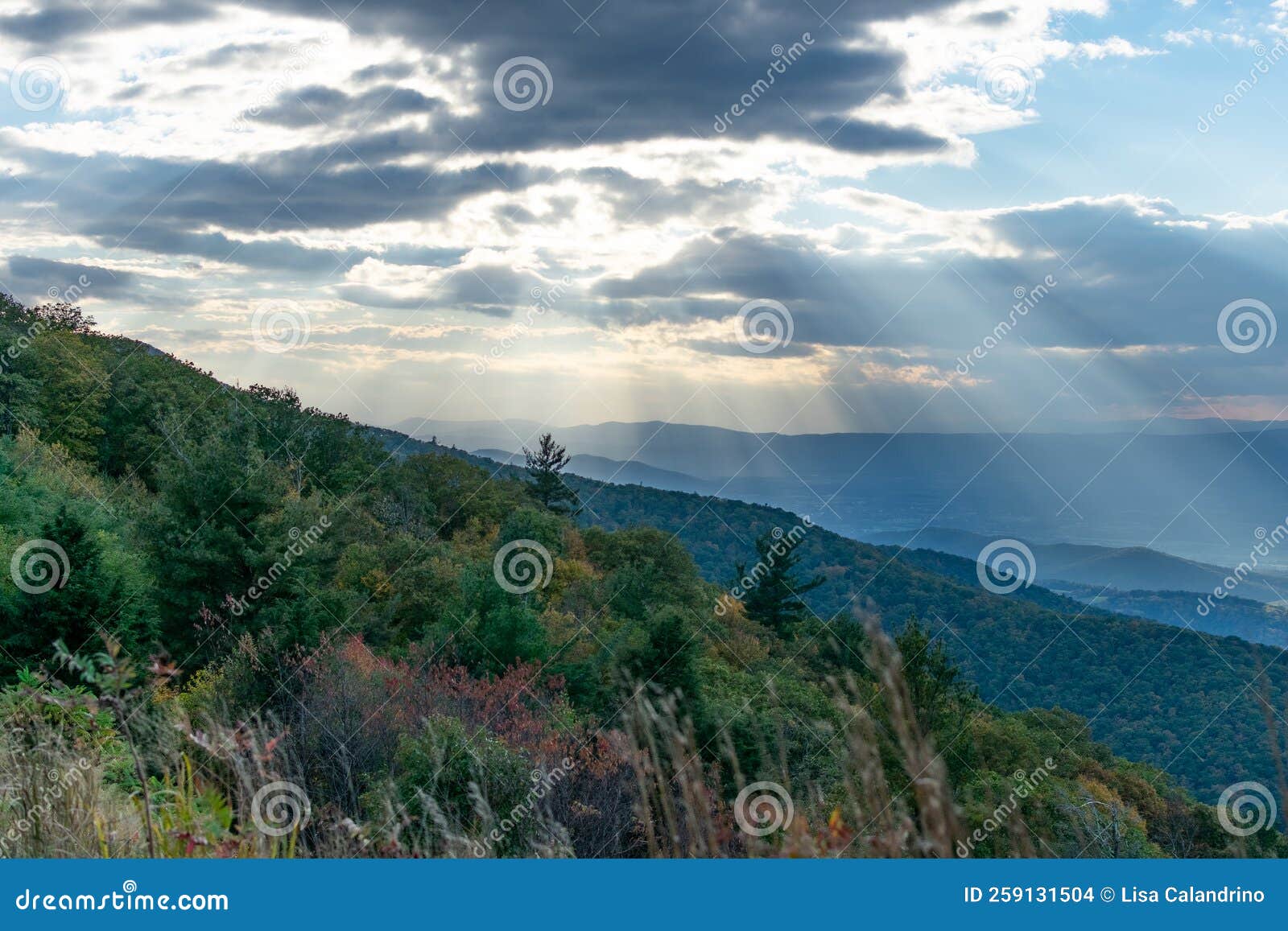 Rays of Light Shine through Clouds Over Blue Ridge Mountains Stock ...