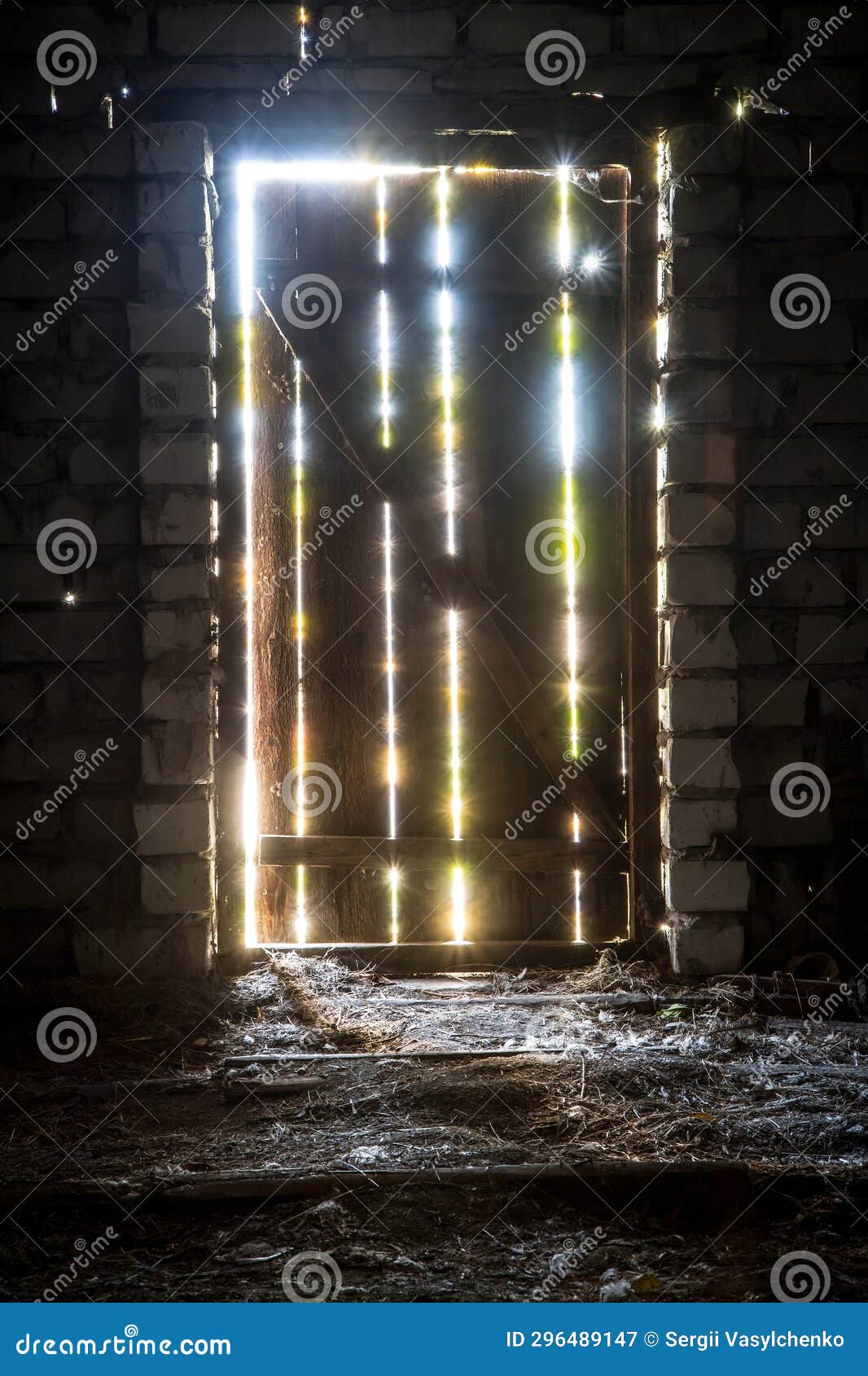 Rays of Light Shine through the Plank Door of an Old Barn. Stock Image ...