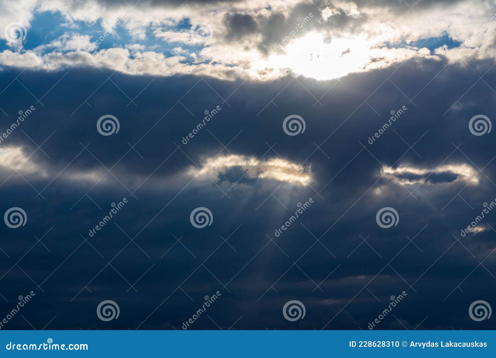 Rays of Light Shining Throug Dark Clouds.Beautiful Dramatic Sky with ...