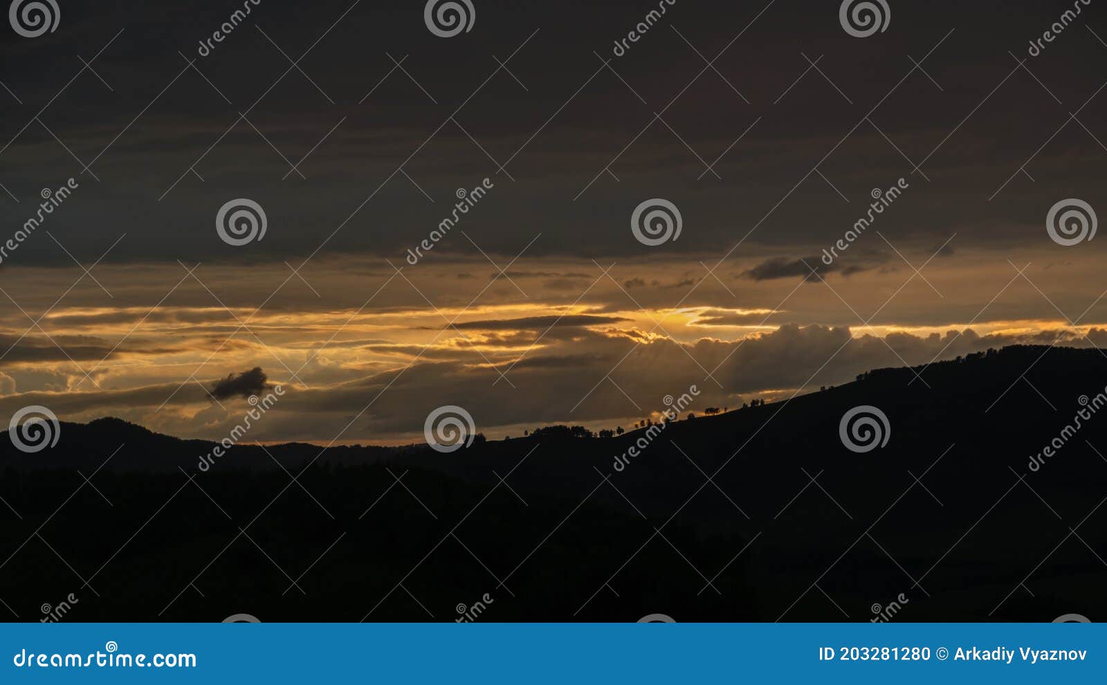 The Rays of the Setting Sun Break through the Clouds Stock Photo ...
