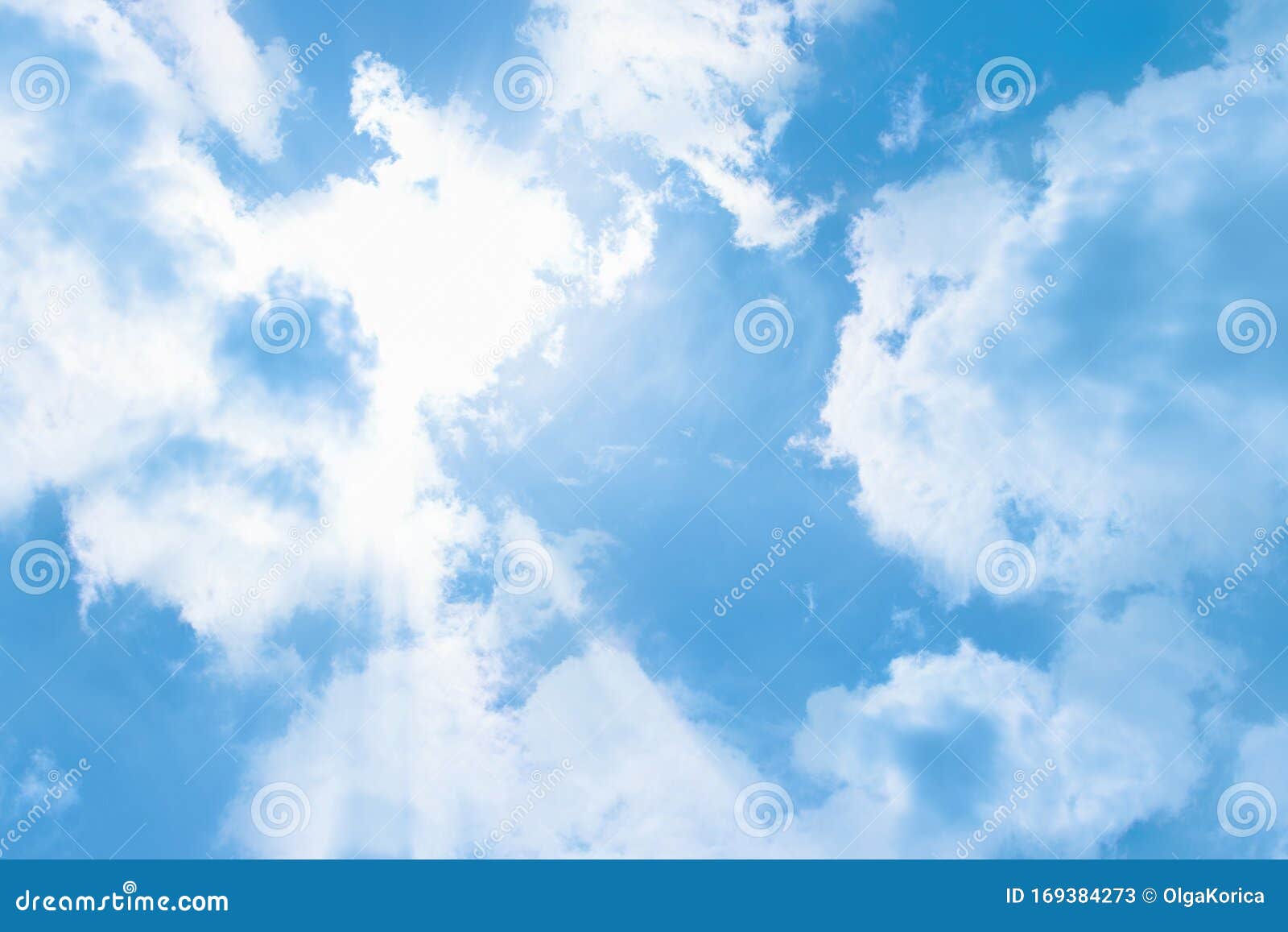 The Rays of the Sun Break through the Clouds, a Clear Blue Sunny Sky ...