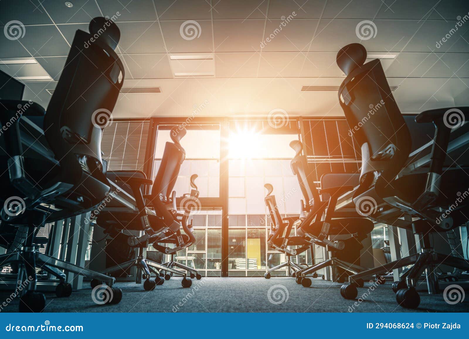 The Rays of the Sun in the Corporation. Sunset between Workstations in ...