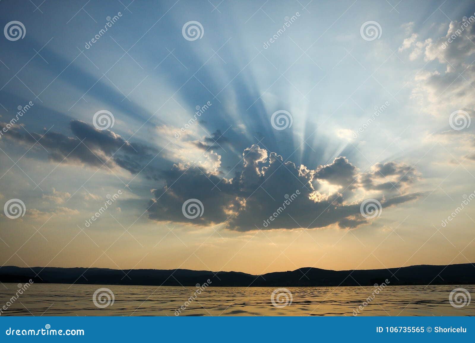 Rays of Sun Light Breaking through from Behind the Clouds with N Stock ...