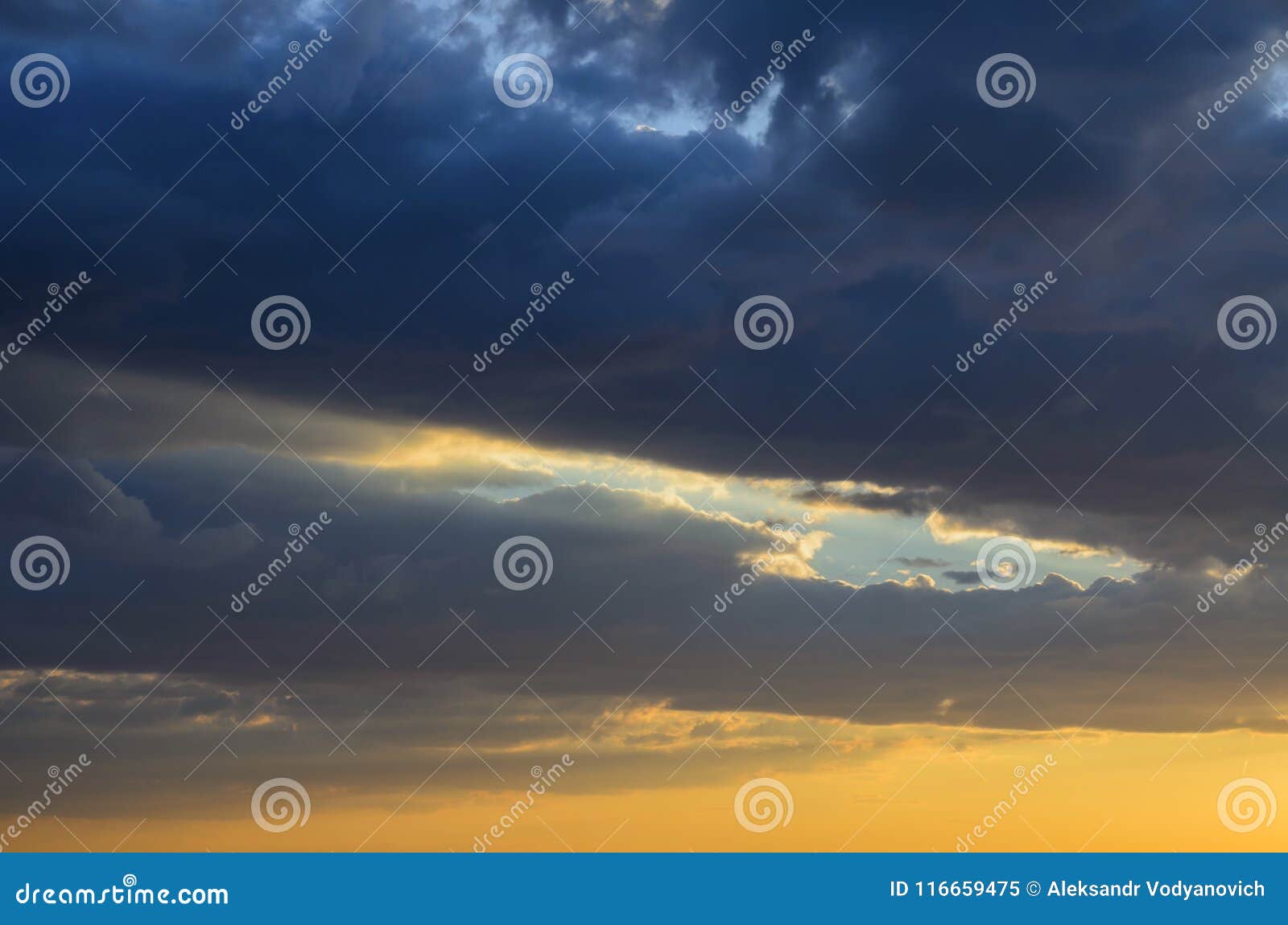 The Rays of the Sun Setting Beyond the Horizon Illuminate the Gray ...