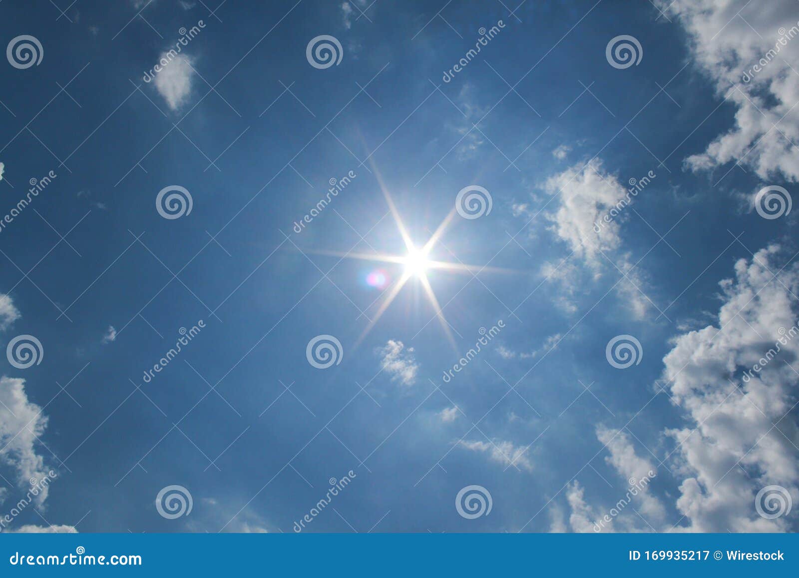 Rays of the Sun Shining in the Dark Sky with a Few Clouds Stock Image ...