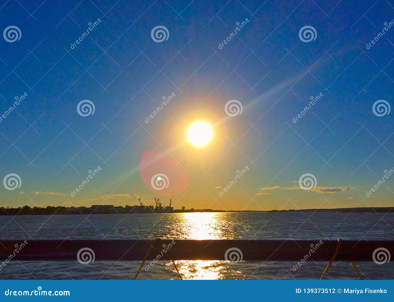 The Rays Of The Sunset Sun Over The Water Stock Photo - Image of ...