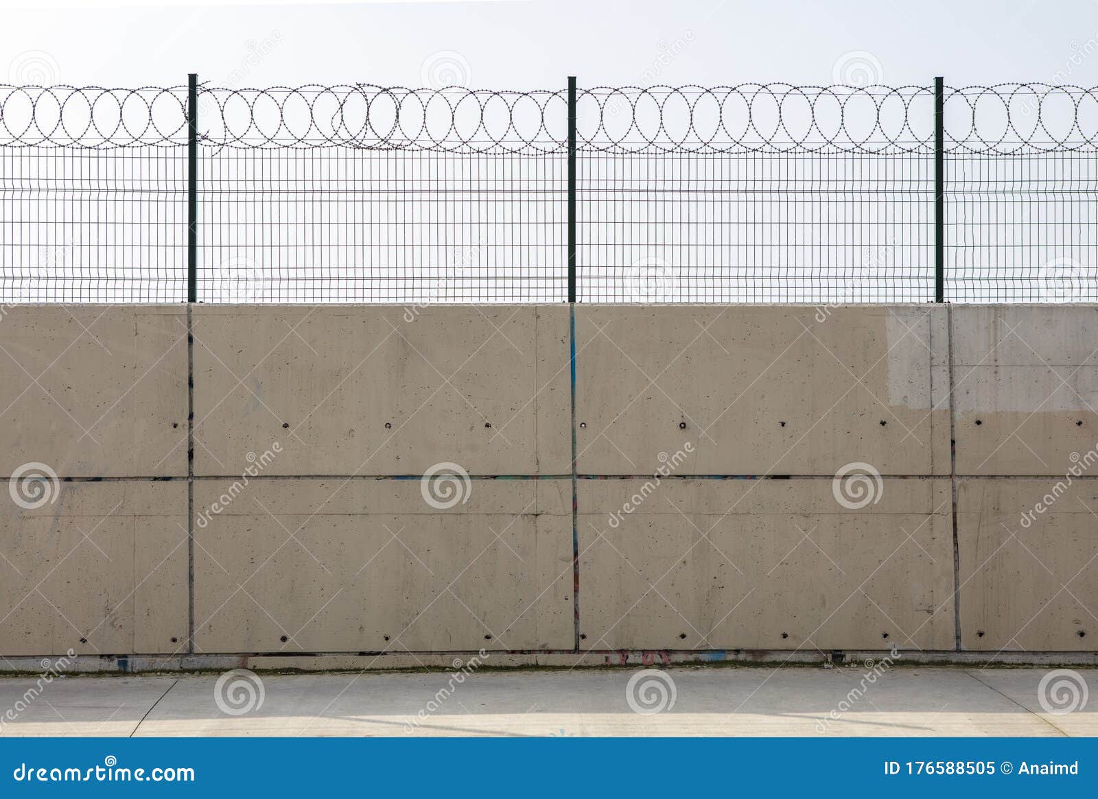Wire with Its Sharp Steel Barbs on Top of a Concrete Wall Stock Image ...