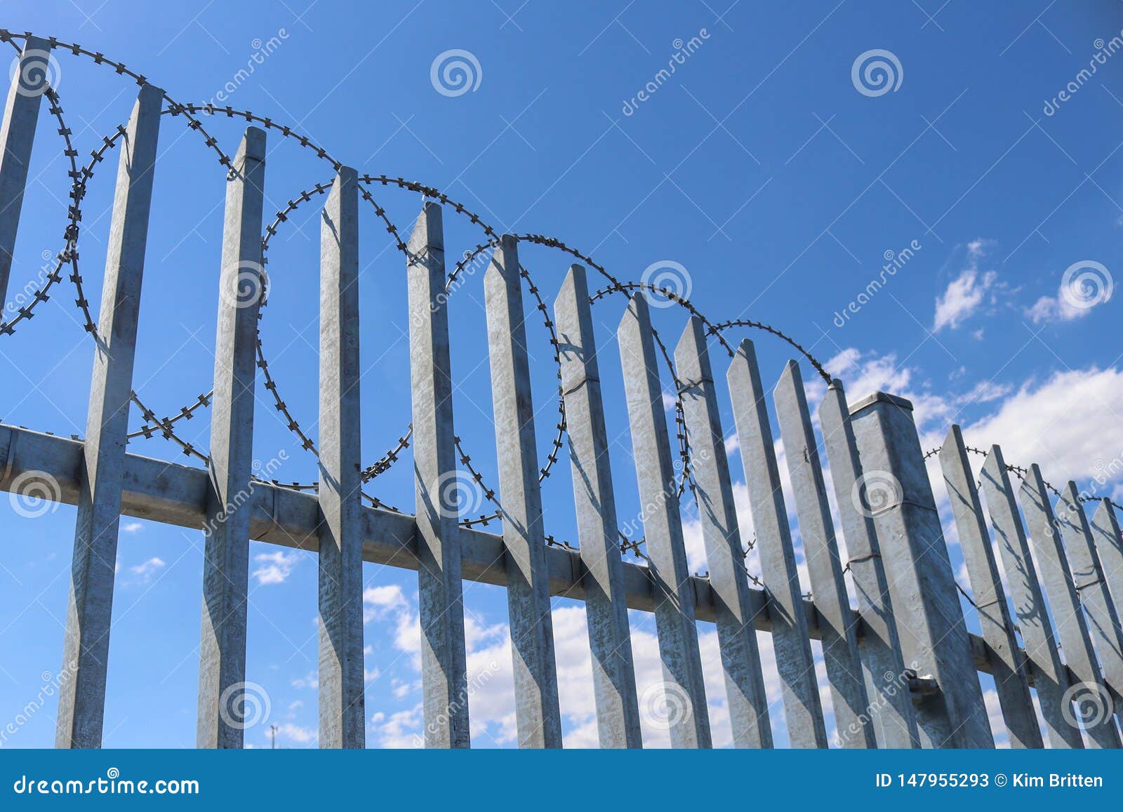 Razor Wire on a Tall Steel Fence Stock Image - Image of wire, refugee ...