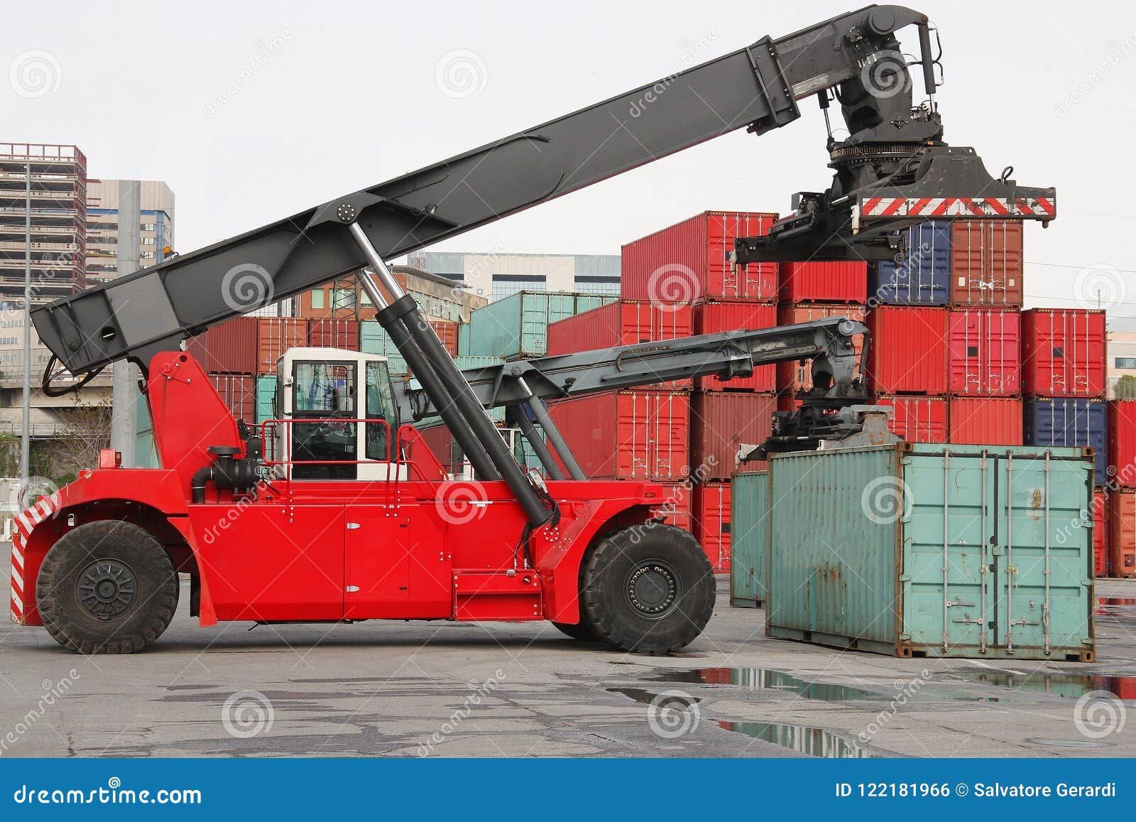 Reach Stacker Vehicle Moving a Container into a Container Terminal Area ...