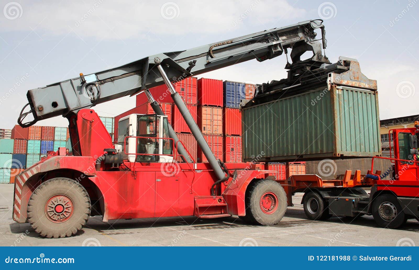 Reach Stacker Vehicle Moving a Container into a Container Terminal Area ...