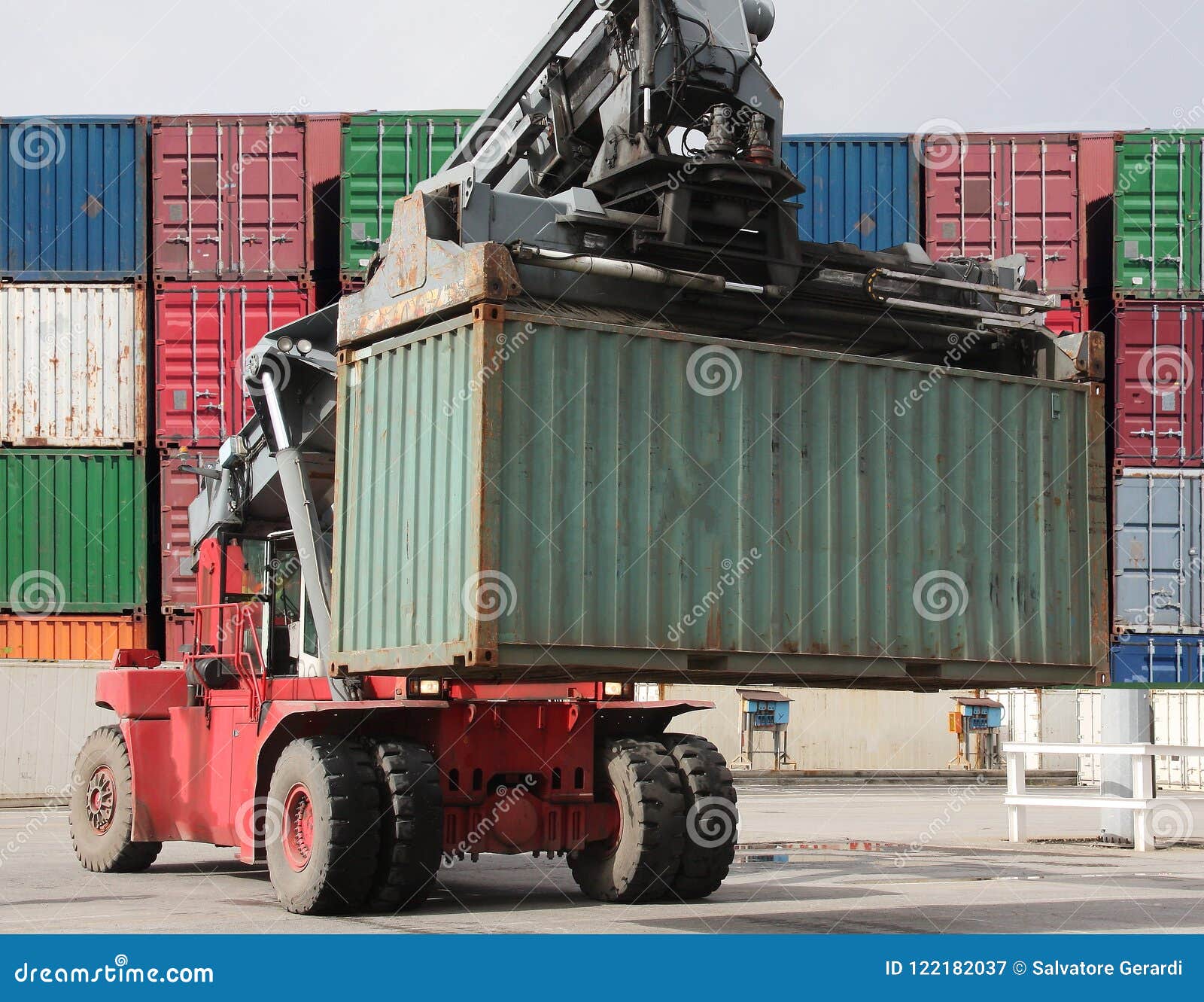 Reach Stacker Vehicle Moving a Container into a Container Terminal Area ...
