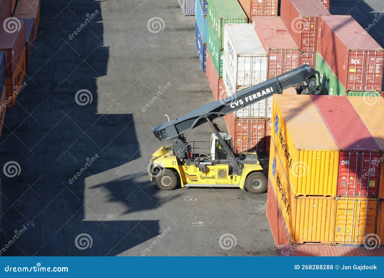 Reach Stacker of Yellow Colour with Black Top Pick Spreader is ...