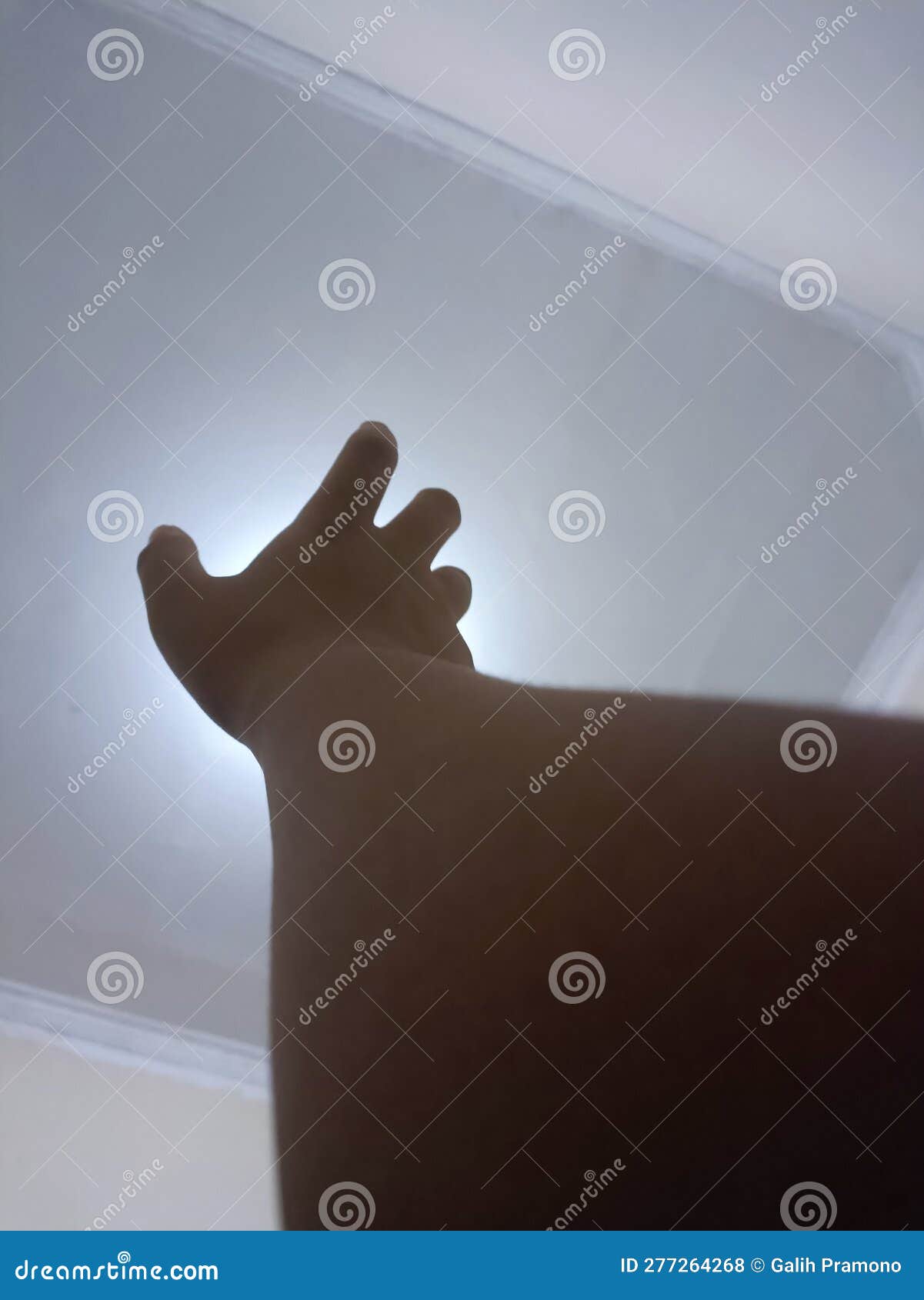 Reaching for the Light with Hands in a White Room? Stock Photo - Image ...