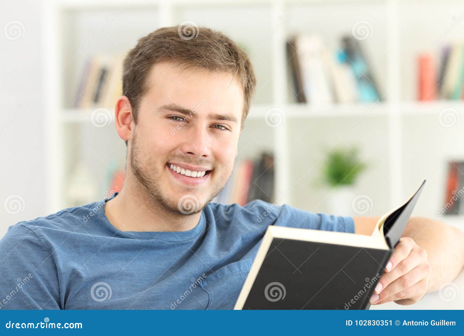 Reader Reading Book and Looking at Camera Stock Image - Image of ...