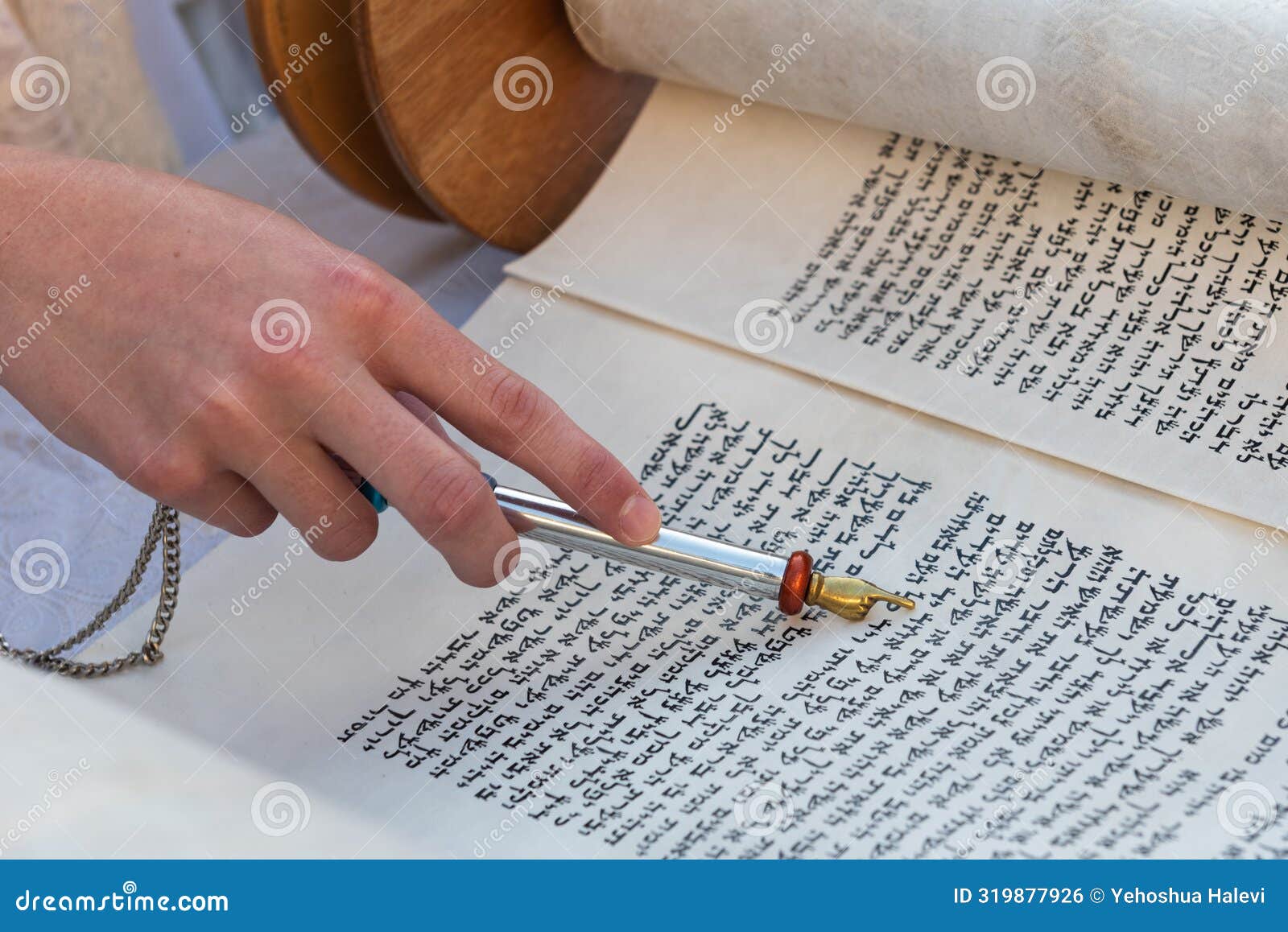 A Reader of the Torah Uses a Yad or Pointer As a Guide Stock Photo ...