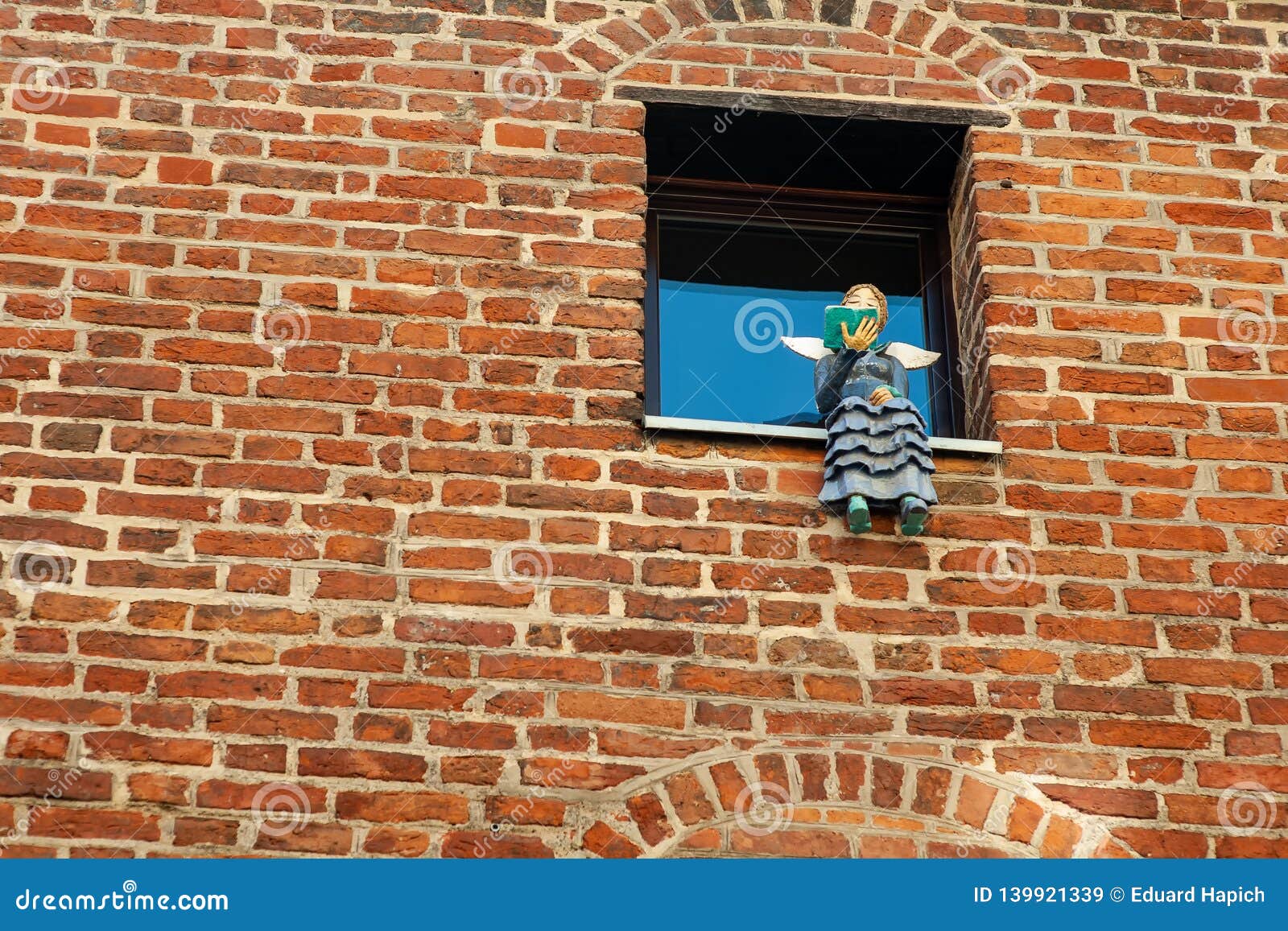 Reading Angel in the Window Stock Image - Image of traditional, street ...