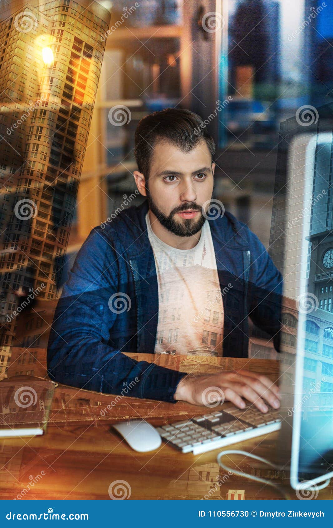 Concentrated Man Looking at the Monitor while Working in His Office ...