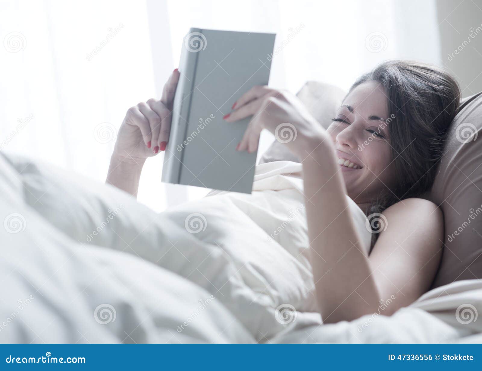 Reading in Bed stock photo. Image of bedding, brown, female - 47336556