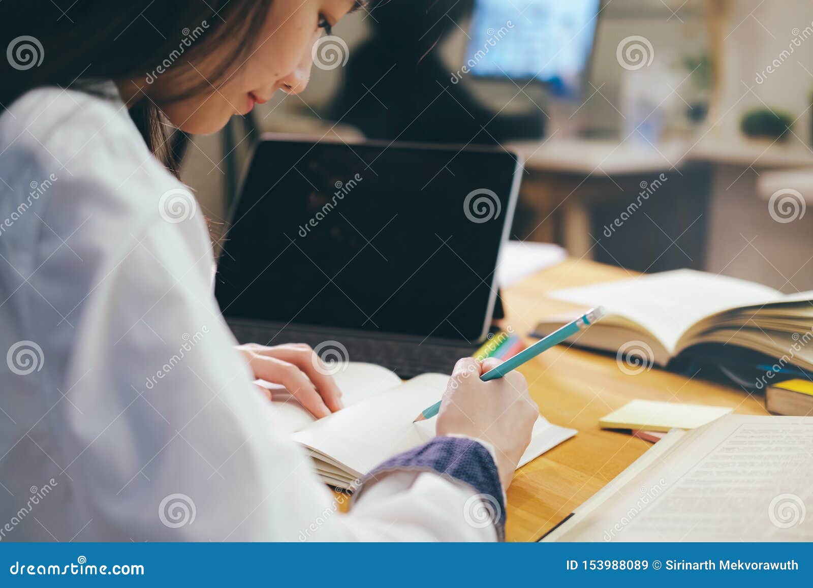 Young Student Reading a Book Stock Image - Image of sitting, school ...