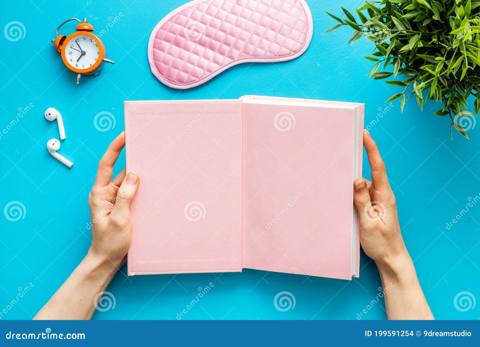 Reading Book before Going To Bed. Sleeping Accessories on the Table ...