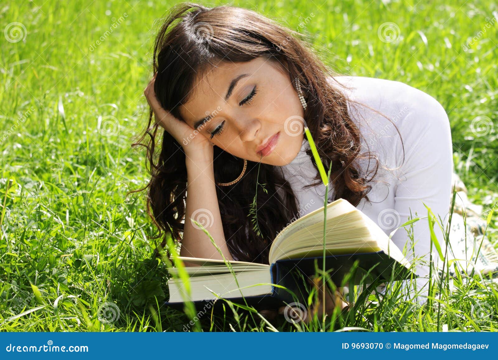 Reading book on grass stock photo. Image of grass, eyes - 9693070
