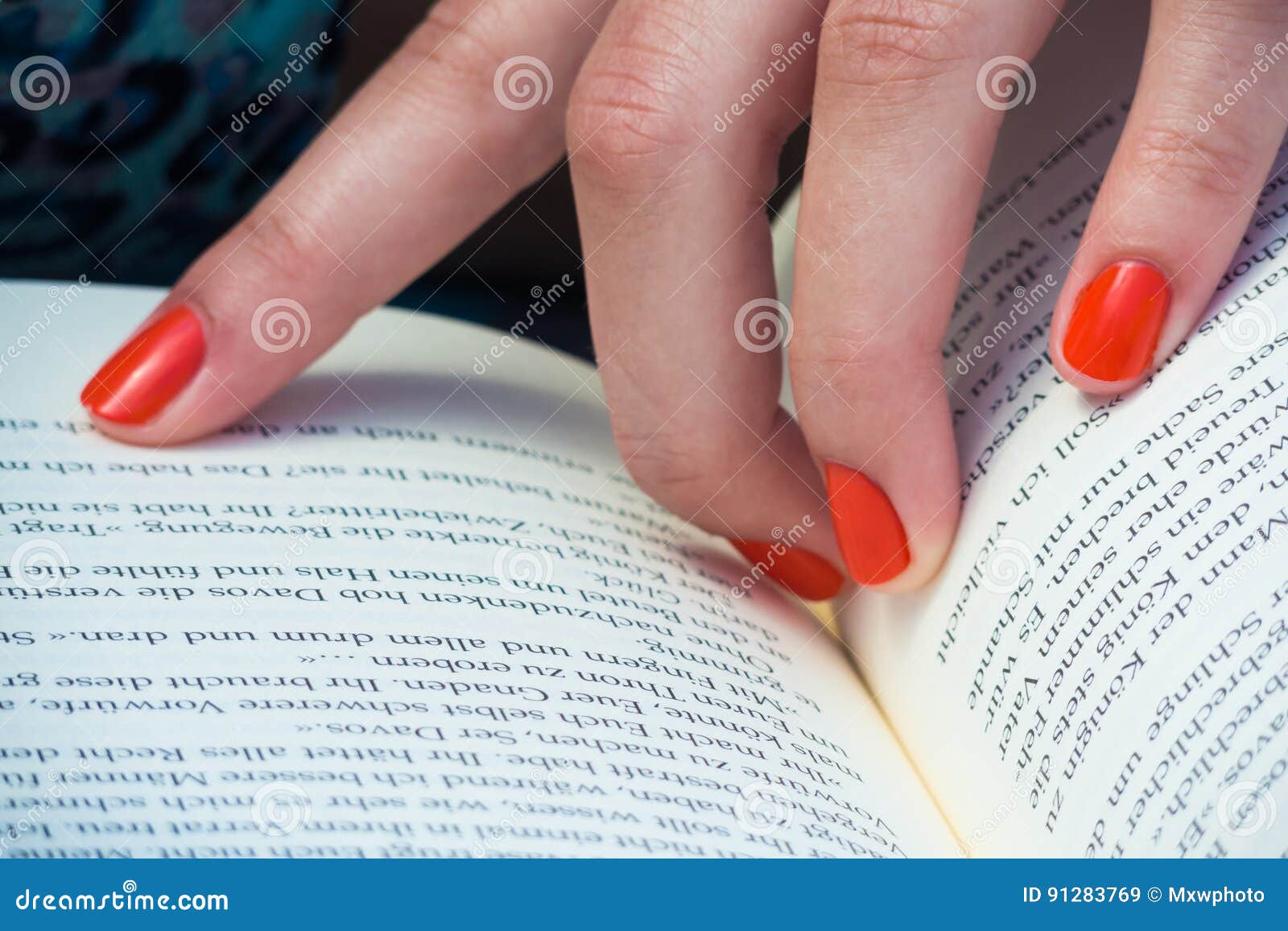 Reading a Book with Orange Finger Nails Stock Image - Image of pointing ...