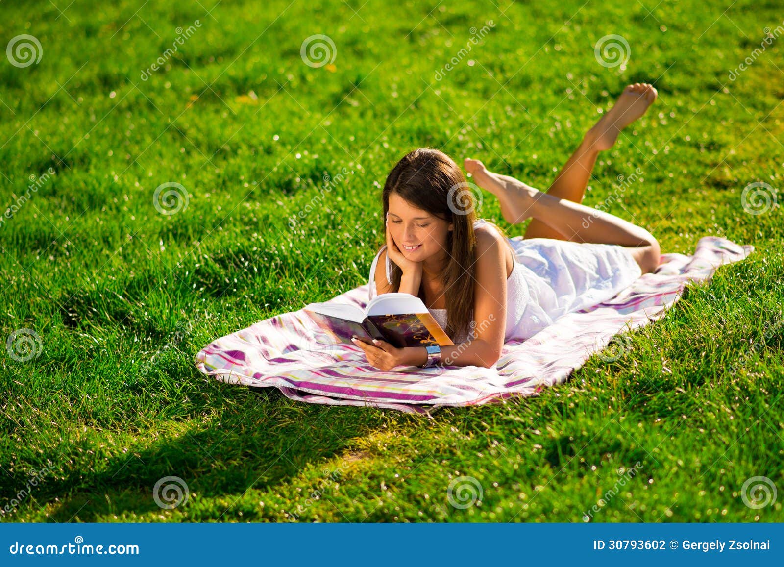 Reading a Book in the Spring Sun Stock Photo - Image of dress, park ...