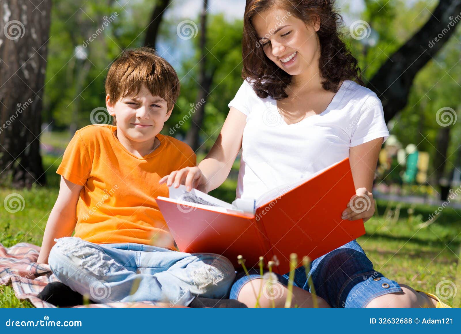 Reading a book together stock photo. Image of beautiful - 32632688