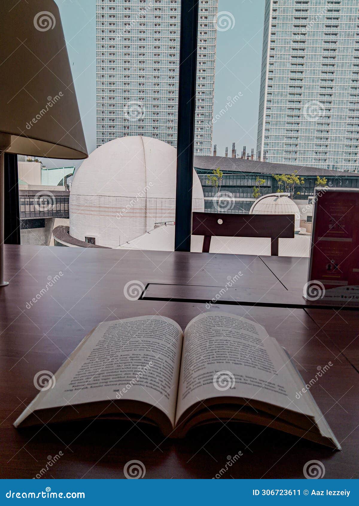 Reading Books in the Library with Views of Tall Buildings in the Middle ...