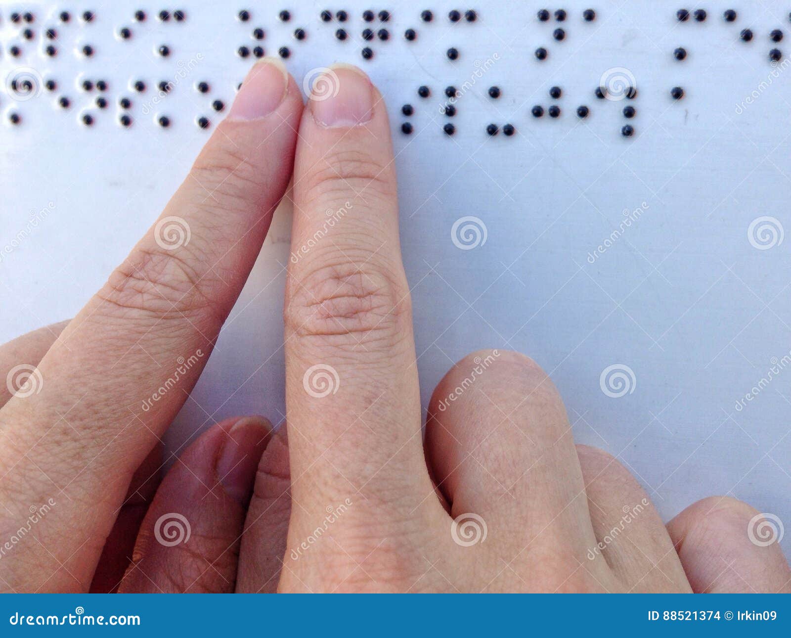 Reading the Braille plate stock photo. Image of person - 88521374