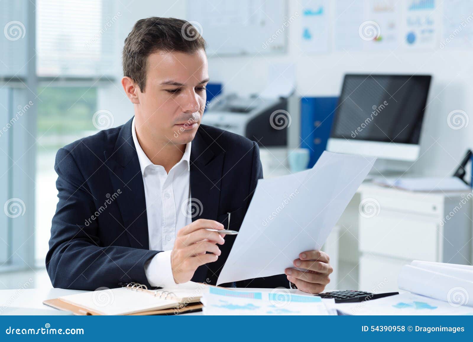Reading a document stock photo. Image of serious, paperwork - 54390958