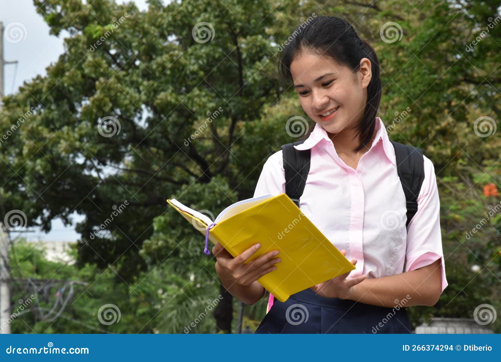 A Reading Filipina Female Student Stock Photo - Image of education ...