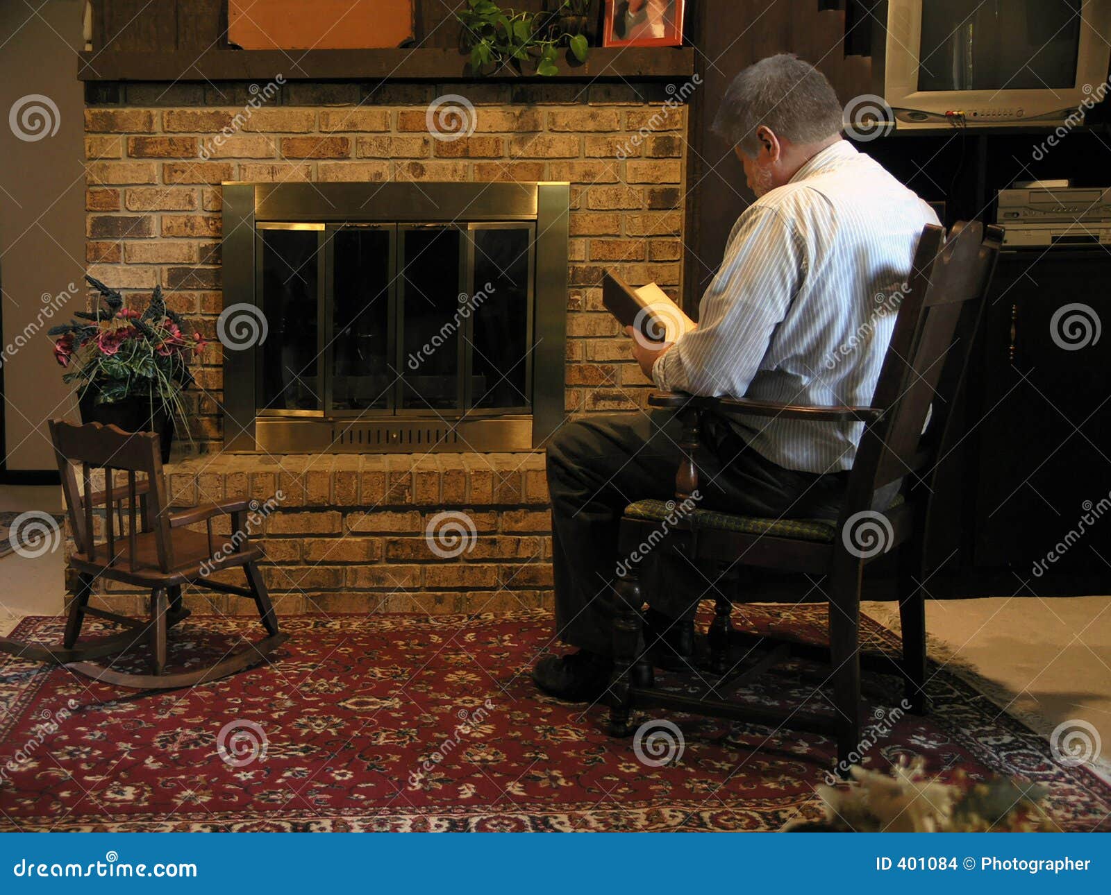 Reading by Fireside stock photo. Image of hearth, interior - 401084