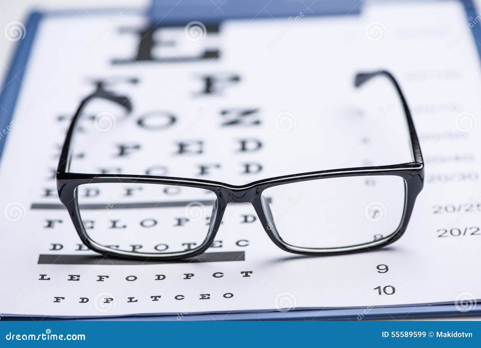 Reading Glasses on Eye Chart Stock Image - Image of astigmatism, blurry ...