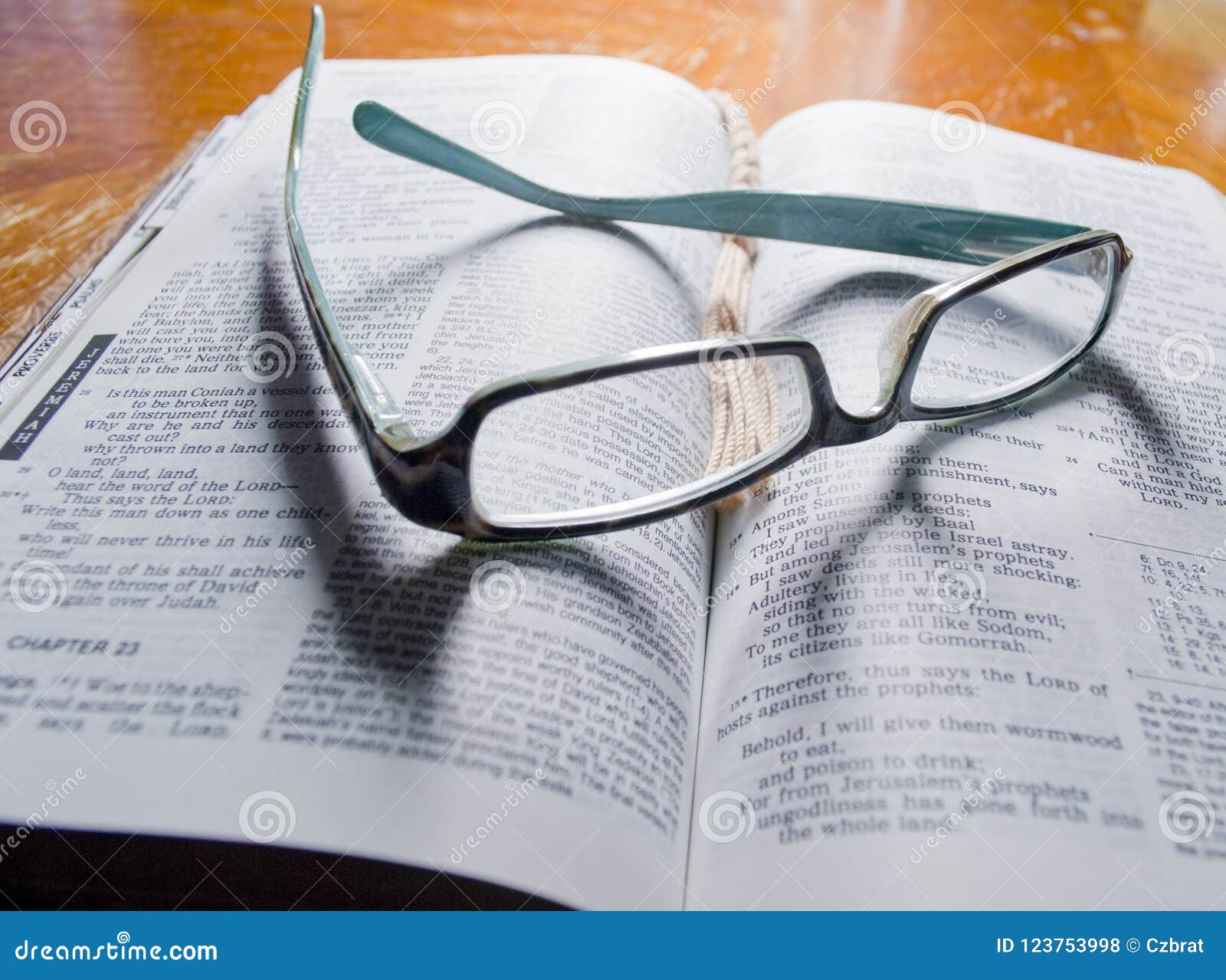 Glasses on Open Bible stock photo. Image of resting - 123753998