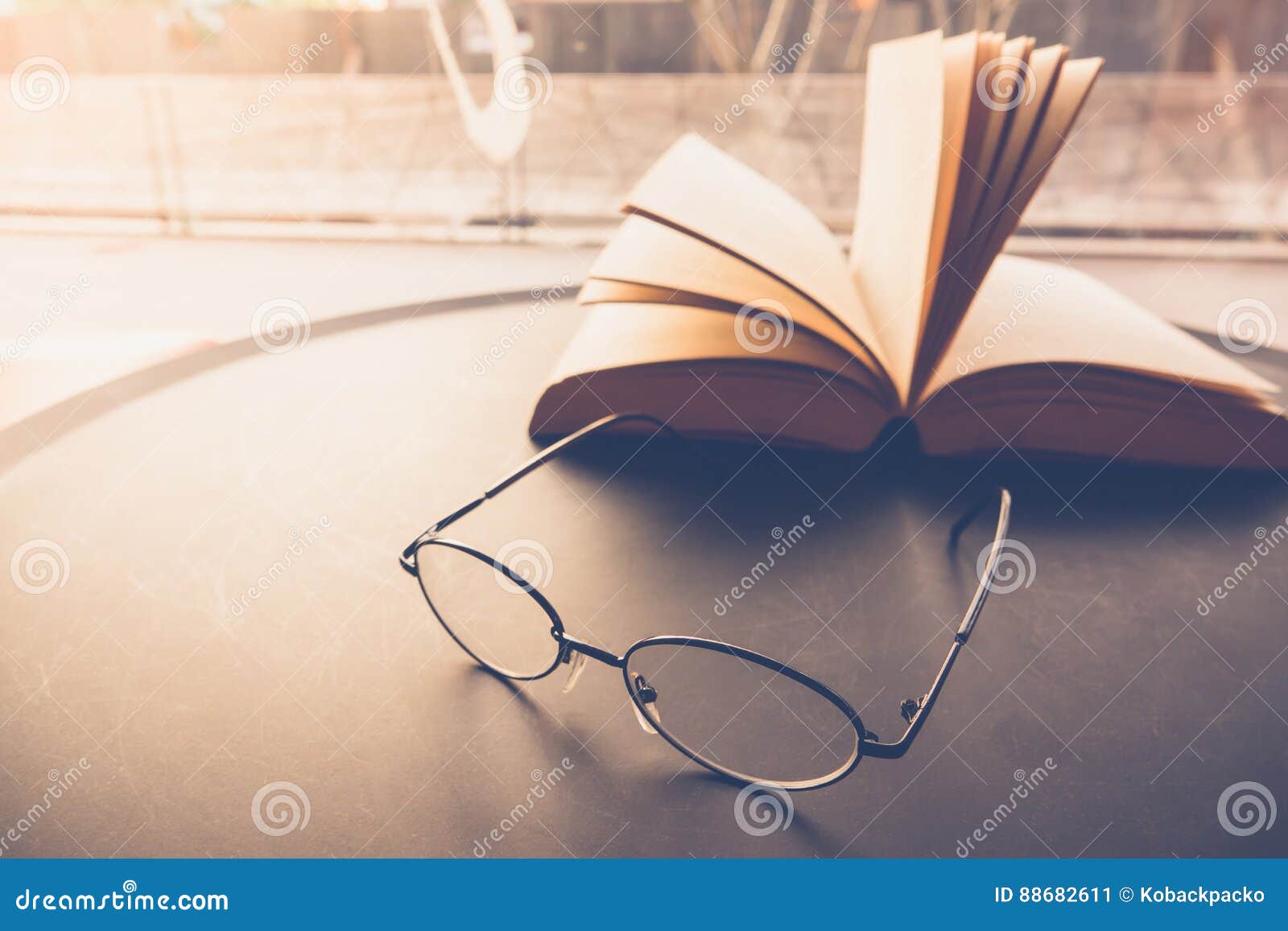 Reading Glasses on Table with Open Book Stock Image - Image of ...