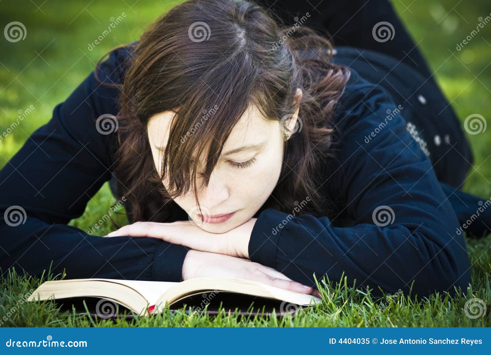 Reading on the grass stock image. Image of enjoyment, model - 4404035