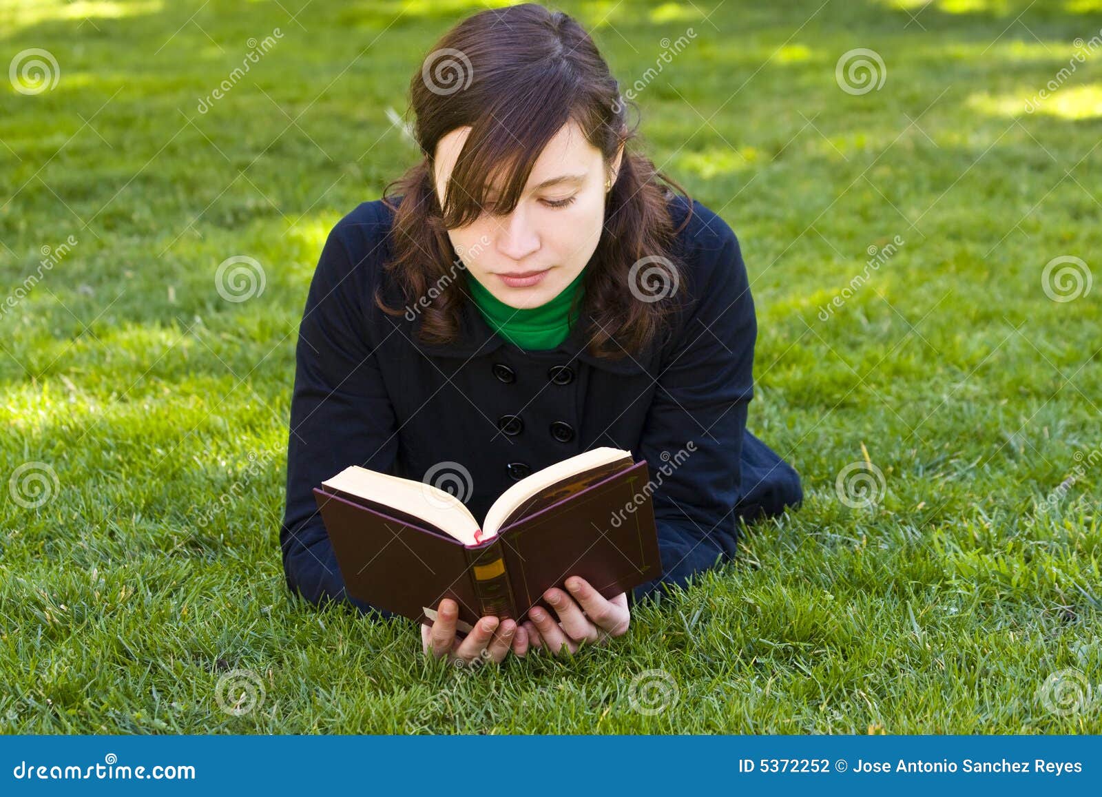 Reading on the grass stock photo. Image of literature - 5372252