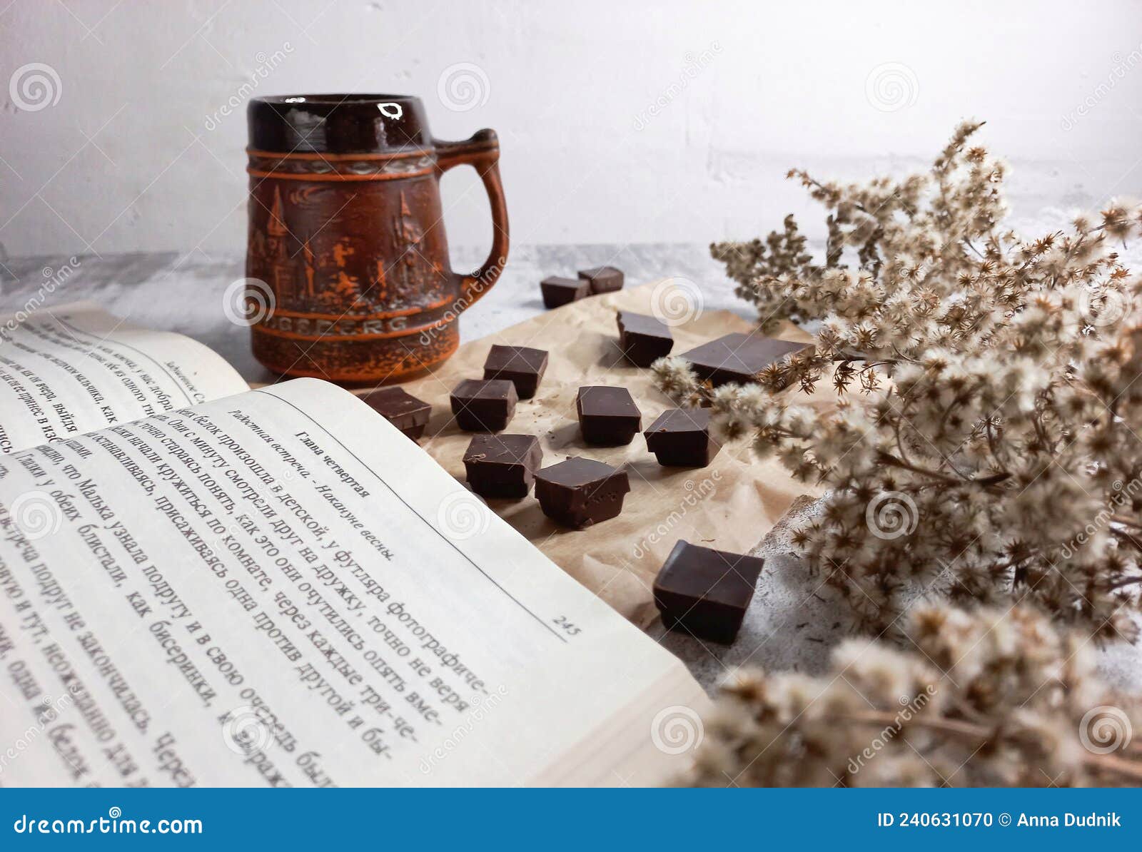 Reading an Interesting Book and Snacking on Chocolate Editorial Image ...