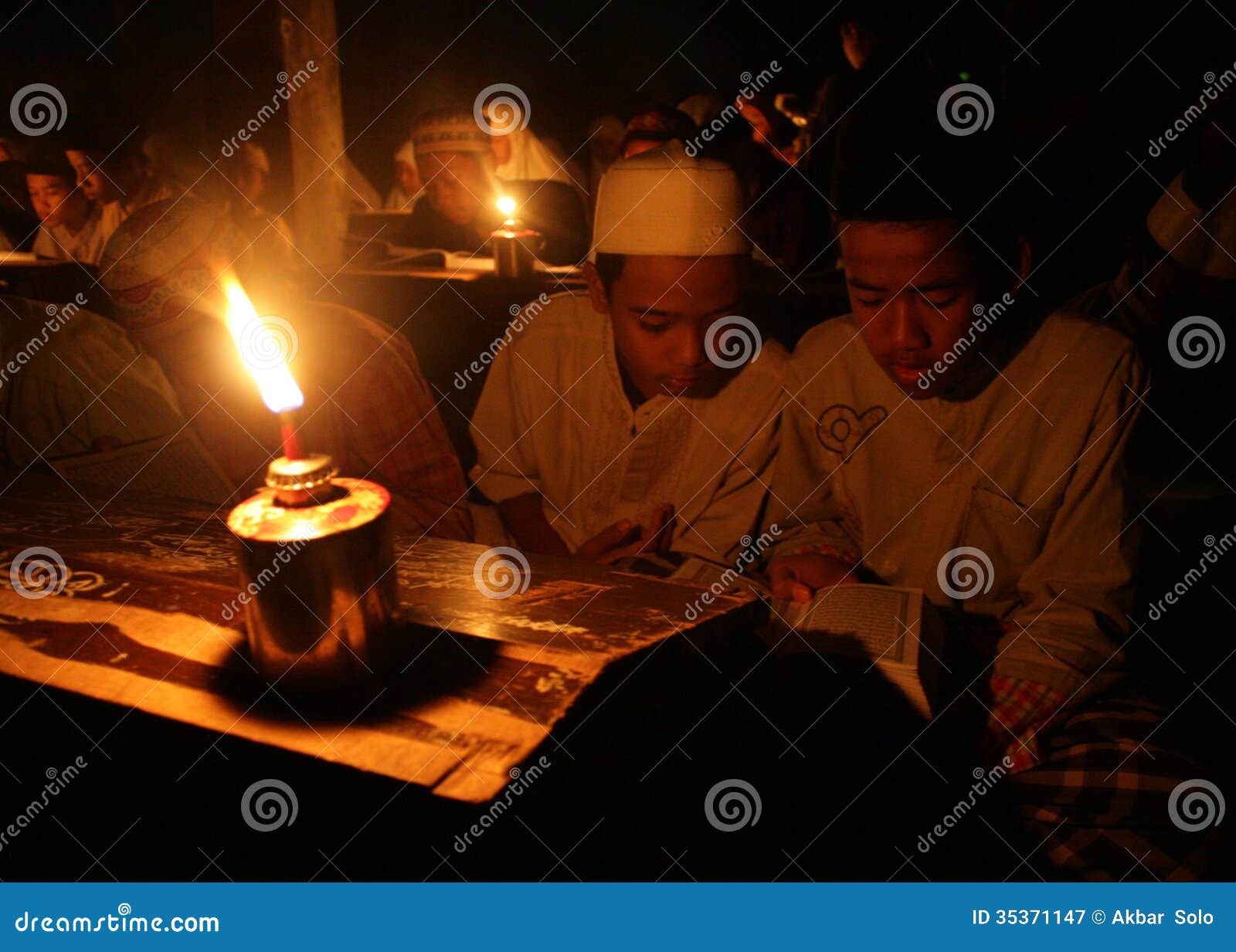 Reading koran using torch editorial photography. Image of muslim - 35371147