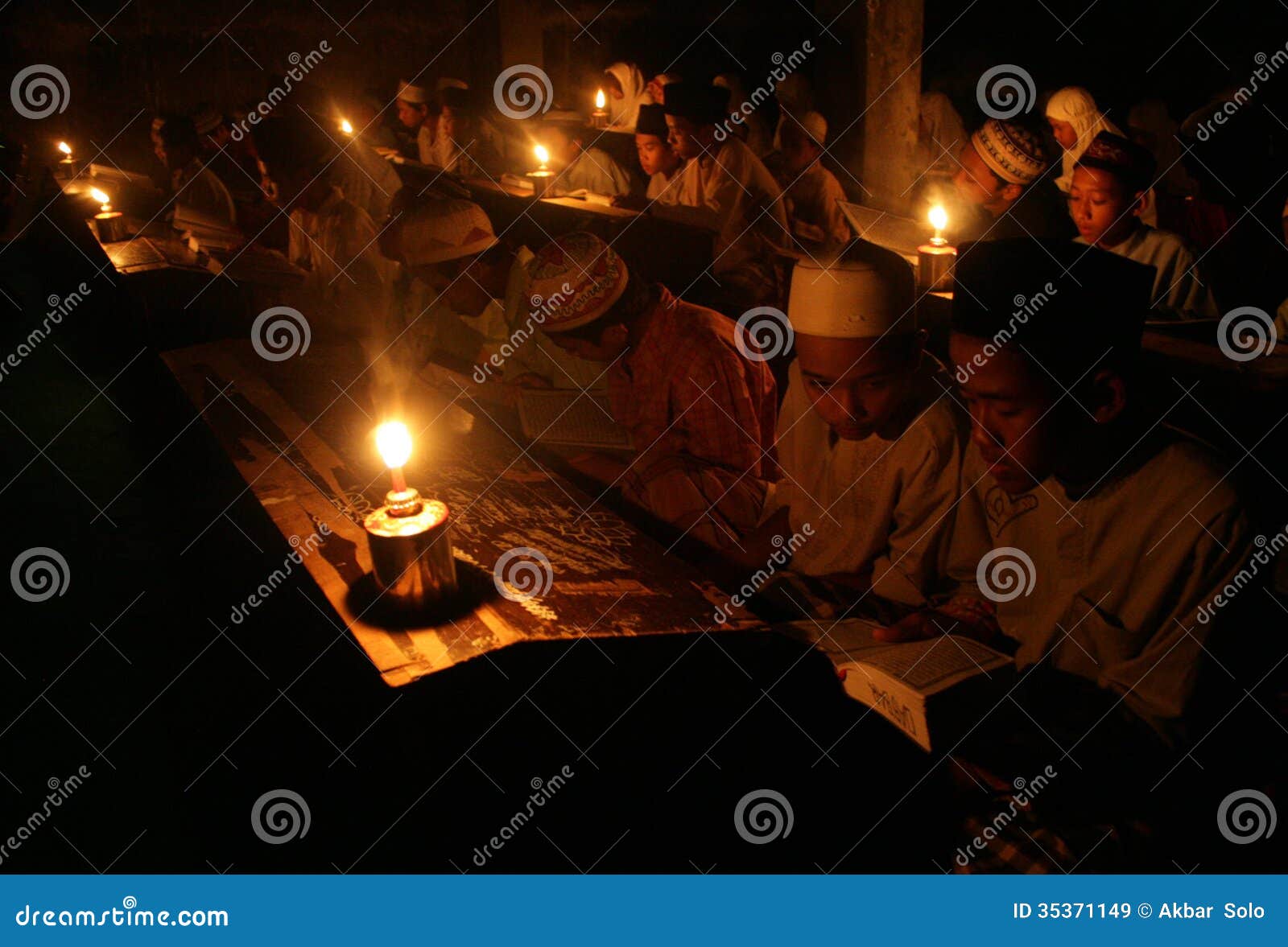 Reading koran using torch editorial stock image. Image of quran - 35371149