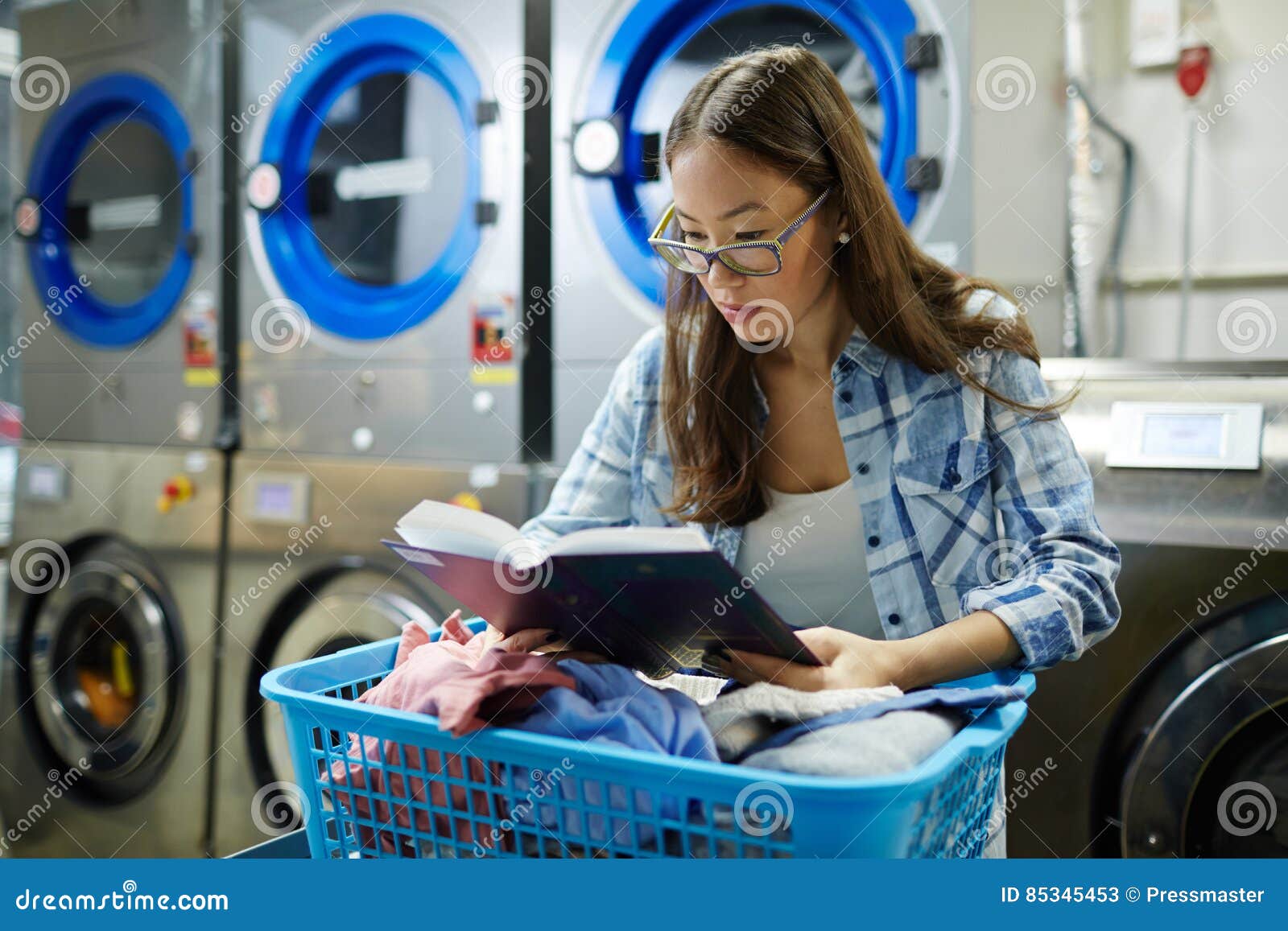 Reading in laundry stock image. Image of heap, clothing - 85345453