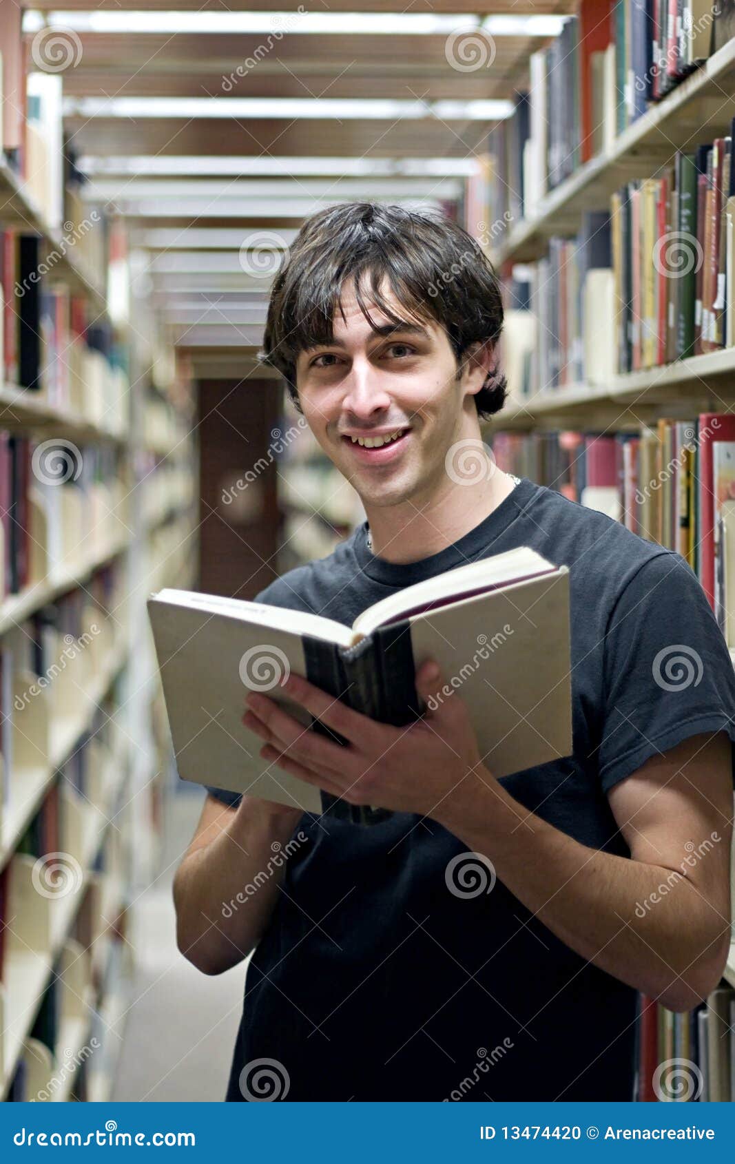 Reading at the Library stock photo. Image of book, aisle - 13474420