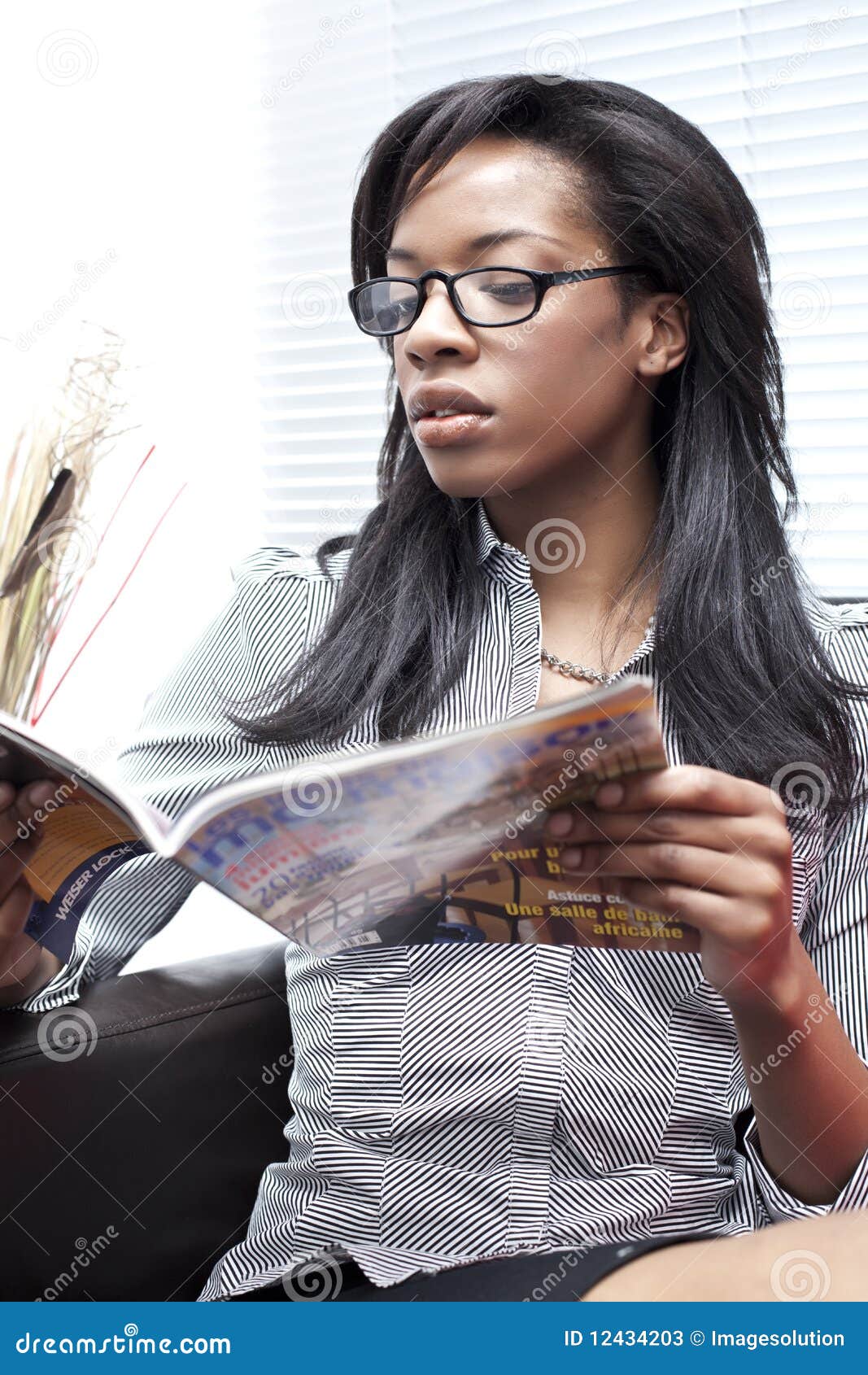 Reading a magazine stock image. Image of girl, cool, indoor - 12434203
